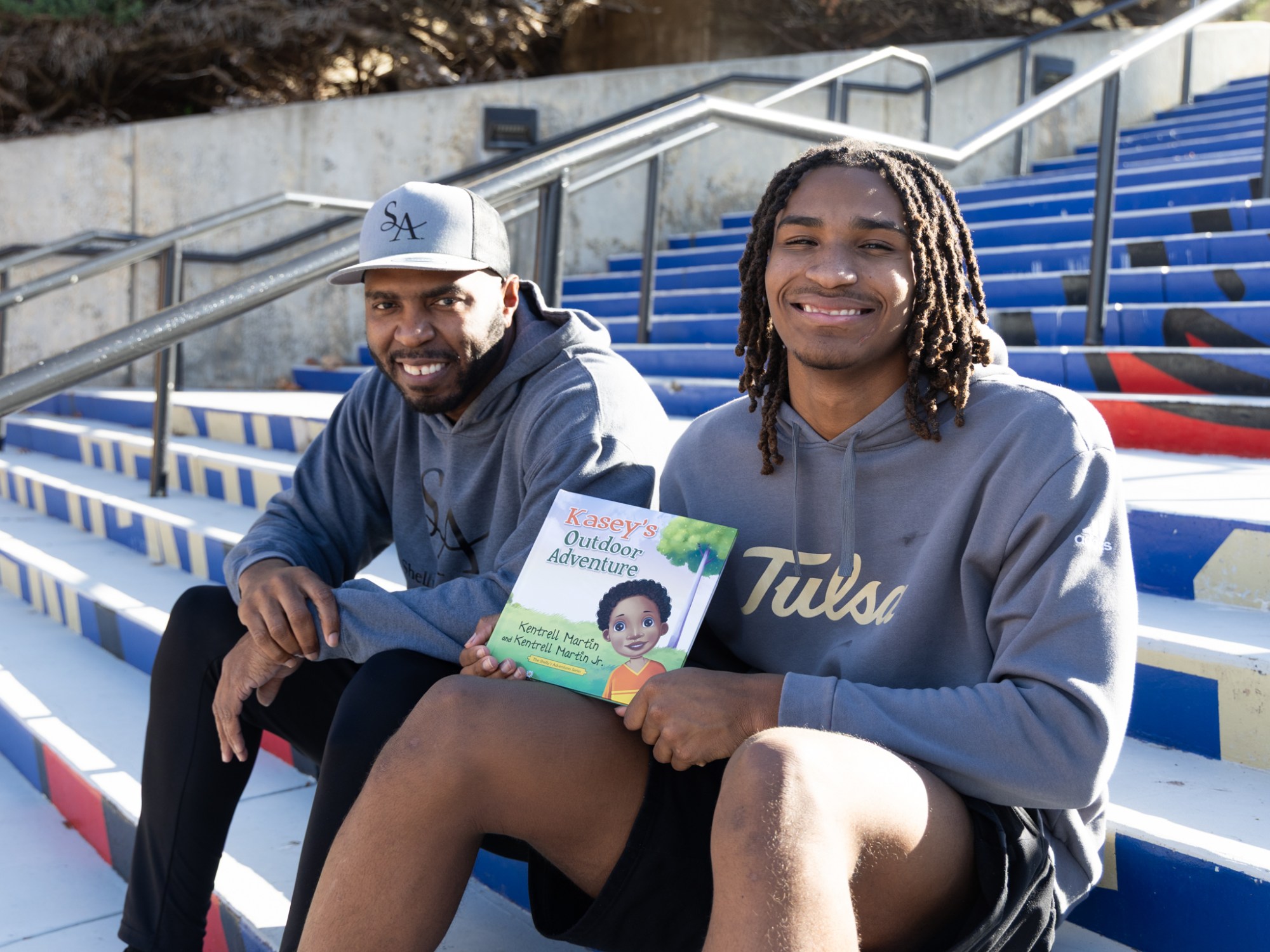 Through book, Tulsa father-son duo help kids learn sign language